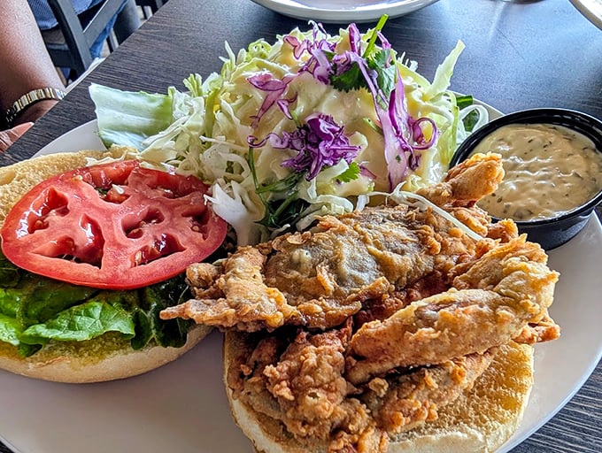A sandwich that answers the eternal question: "How much crispy fried seafood can you fit between two pieces of bread?" The answer: gloriously too much.
