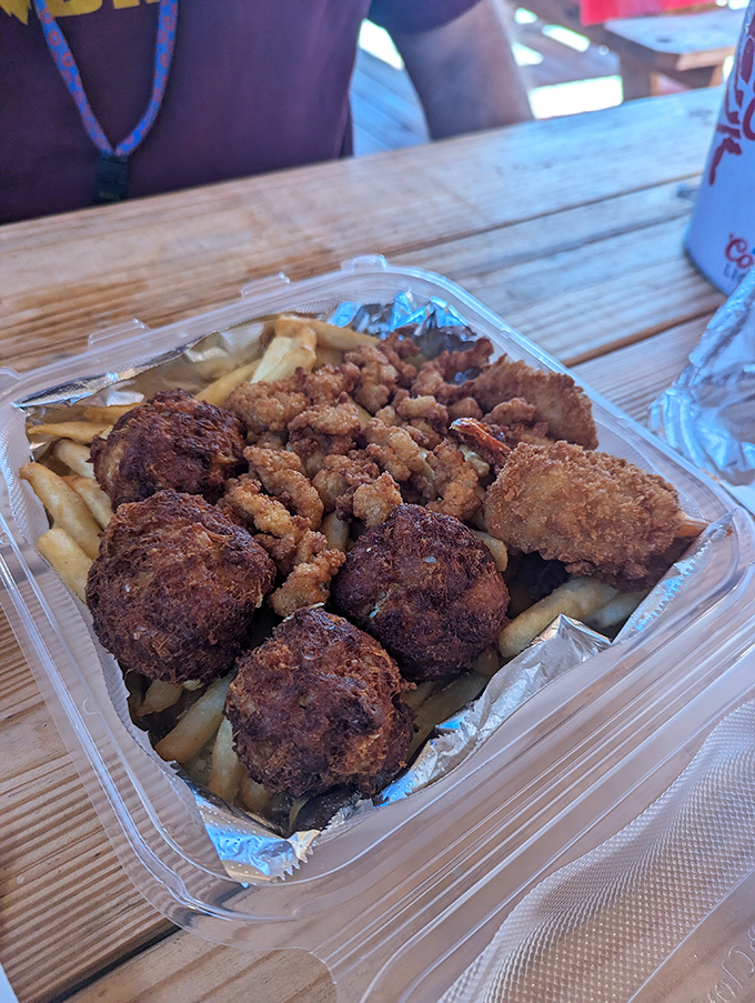 A platter that answers the eternal question: "Why choose one seafood when you can have them all?" Hush puppies included for good measure.