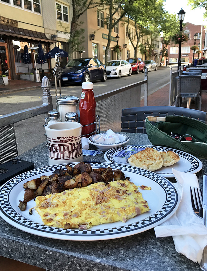 Breakfast with a view &ndash; where fluffy omelets meet home fries in perfect harmony while New Canaan's main street provides the morning entertainment.