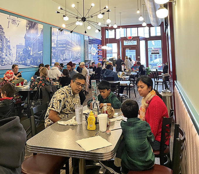 The dining room buzzes with the energy of families creating memories over forkfuls of comfort food, proving that the best social network has always been a shared table.