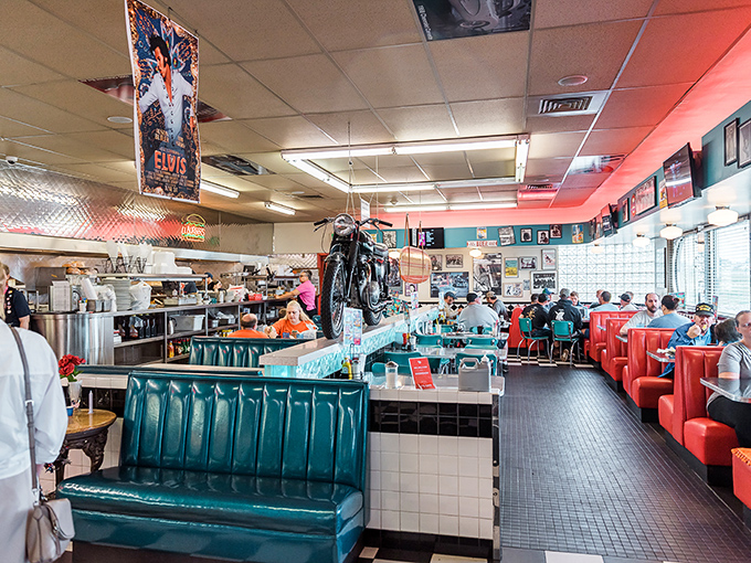 The dining room where calories fear to tread. Those turquoise booths have witnessed countless first dates, family celebrations, and the silent contemplation that follows the perfect bite.