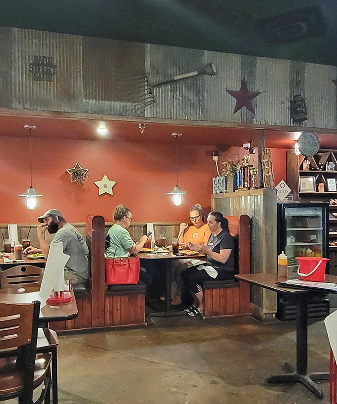 The rustic barn-inspired interior makes you feel like you've stumbled into a secret barbecue clubhouse. Where wooden stars and pendant lights create the perfect meat-eating ambiance.