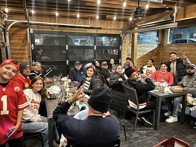 The patio at Q39 becomes a gathering place for Chiefs fans, where barbecue brings together strangers united by sauce-stained fingers.