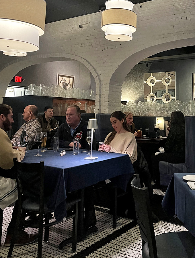 The dining room buzzes with the energy of people who've discovered that great seafood doesn't require an ocean view.