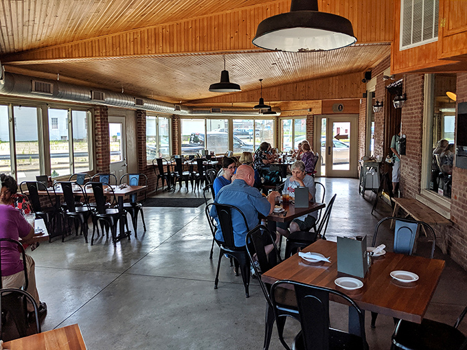 The dining room hums with the universal language of "mmm" as patrons engage in the serious business of barbecue appreciation.