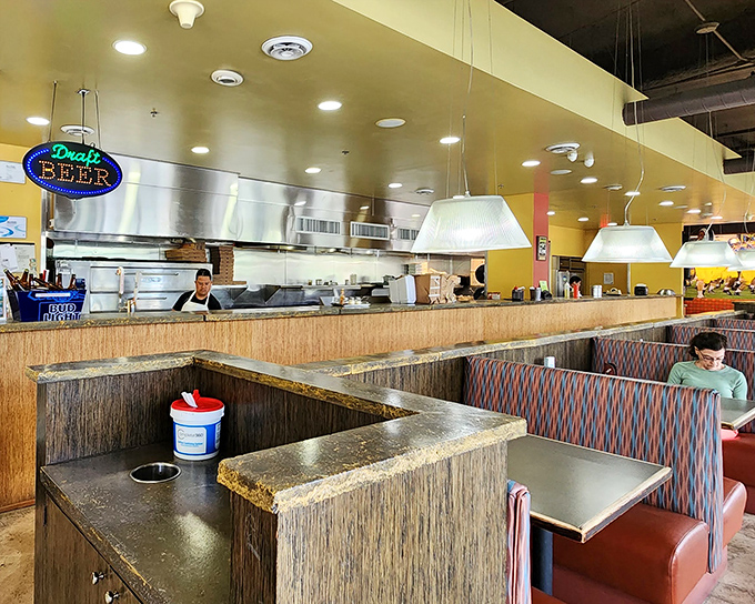 The open kitchen design isn't just practical &ndash; it's dinner theater where spatula-wielding artists perform their craft before an appreciative audience.