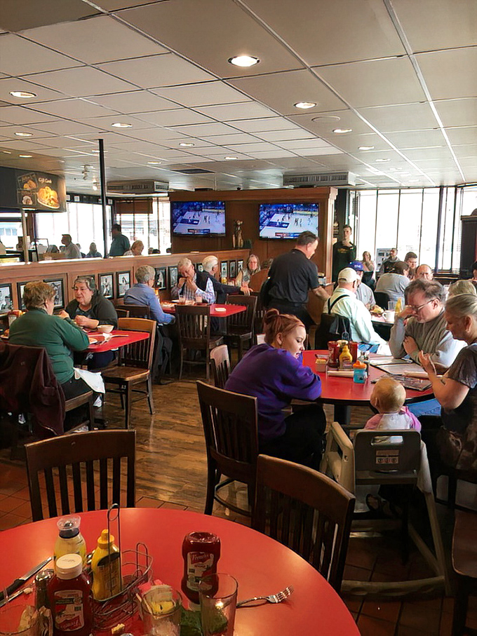 The bustling dining room where strangers become friends over shared glances that silently ask, "Is your food as amazing as mine looks?"
