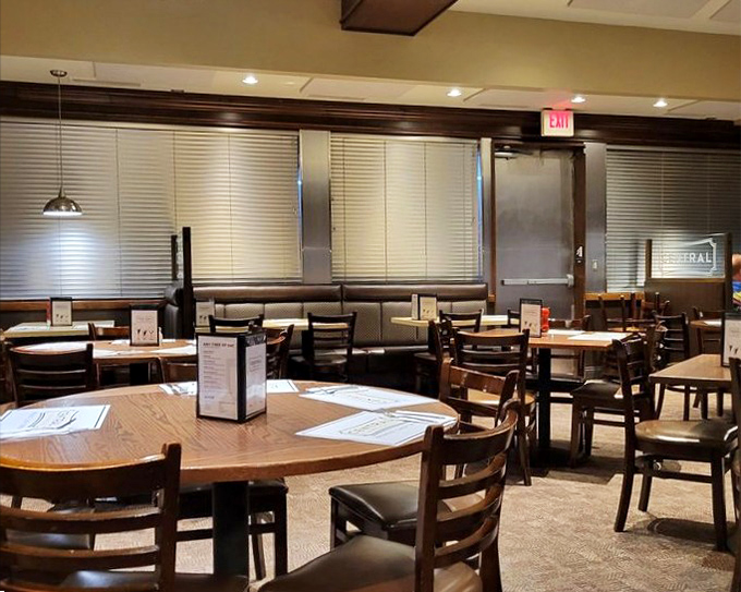 Empty tables waiting for the lunch rush like actors before curtain call. Soon they'll host the daily drama of "Decisions, Decisions: The Menu Musical."