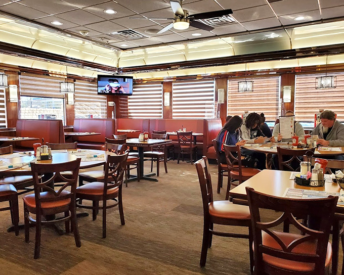 The dining area strikes that perfect balance between spacious and cozy, where strangers become temporary neighbors united by the universal language of good food. 