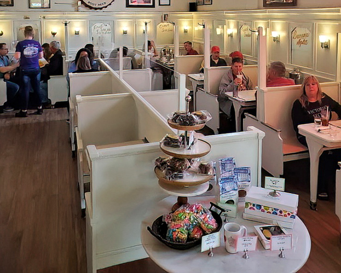 White booths lined up like elegant soldiers guarding culinary treasures. The dining area feels like your grandmother's kitchen, if grandma were a dessert genius. 