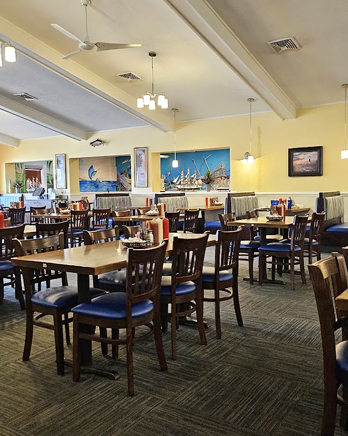 Wooden chairs, blue accents, and the promise of seafood magic. This dining room doesn't need fancy frills when the food does all the talking.