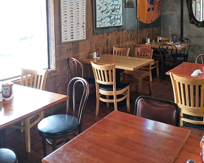 Wood-paneled walls and mismatched seating create that authentic diner vibe where everyone feels like a regular.