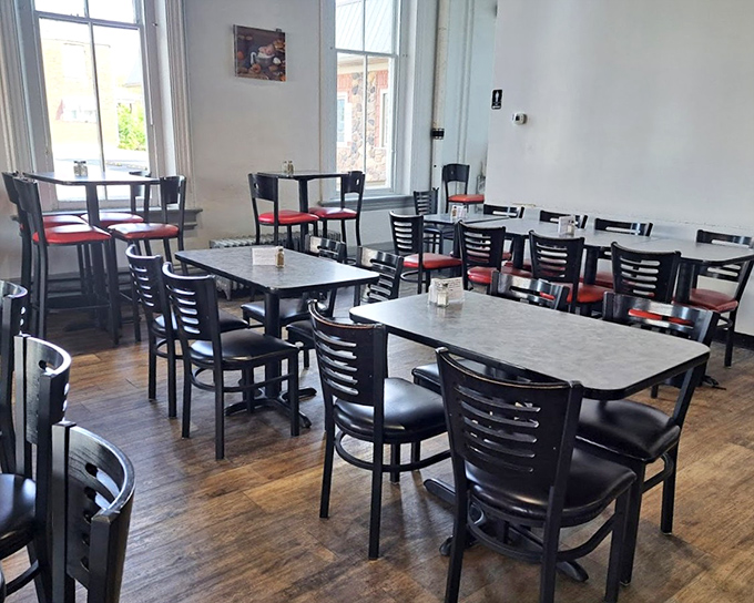 The calm before the delicious storm&mdash;empty tables that will soon host the symphony of clinking forks and satisfied sighs. Morning light streams in like nature's spotlight.