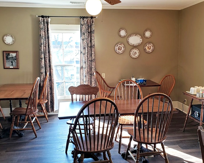 A dining room where strangers become friends over passed platters. Those Windsor chairs have supported more satisfied diners than a cardiologist's waiting room. 