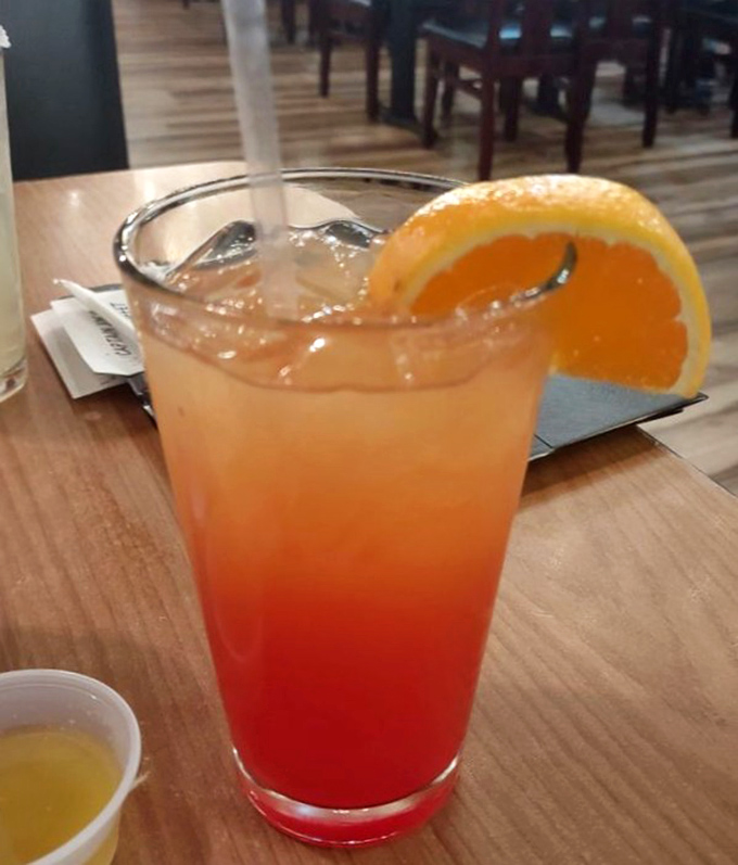 This sunset-in-a-glass cocktail brings tropical vibes to Tennessee—proving paradise is wherever good drinks and seafood meet.