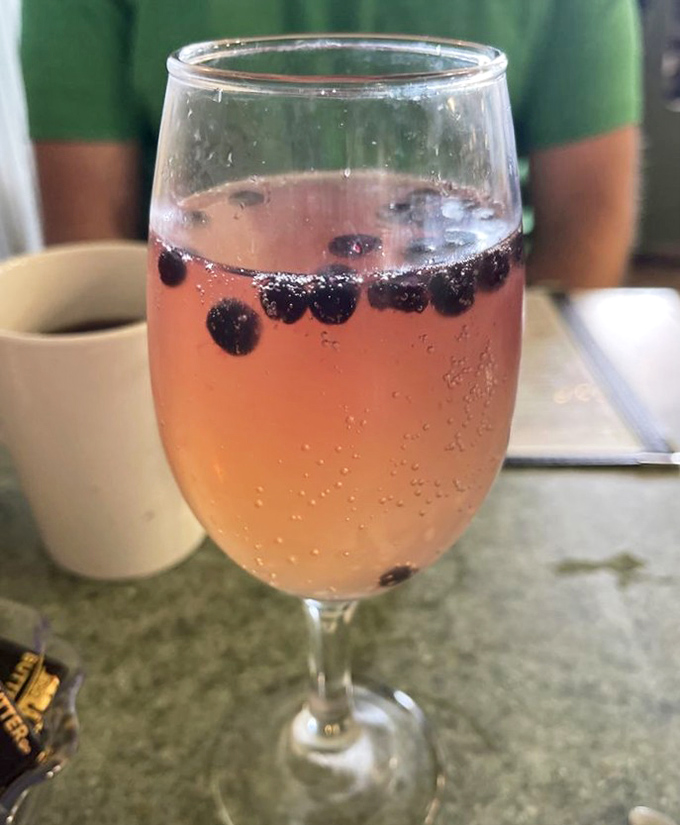 A blush-pink beverage dotted with blueberries&mdash;Maine's signature fruit floating like tiny buoys in a refreshing sea. Summer in a glass.