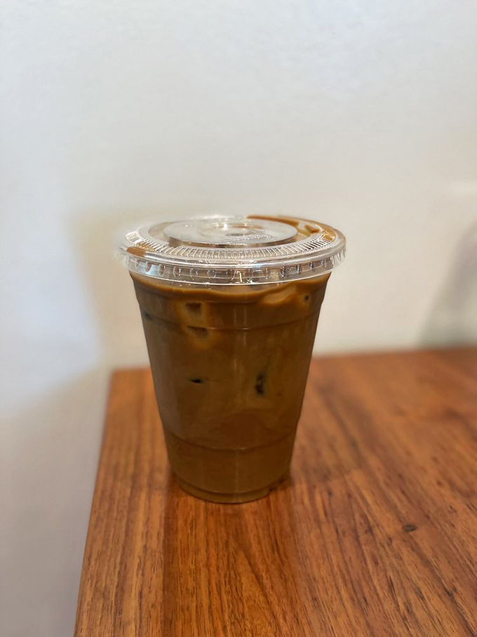 Malaysian kopi isn't just coffee; it's liquid therapy with condensed milk that makes your usual morning brew seem like it needs to try harder.