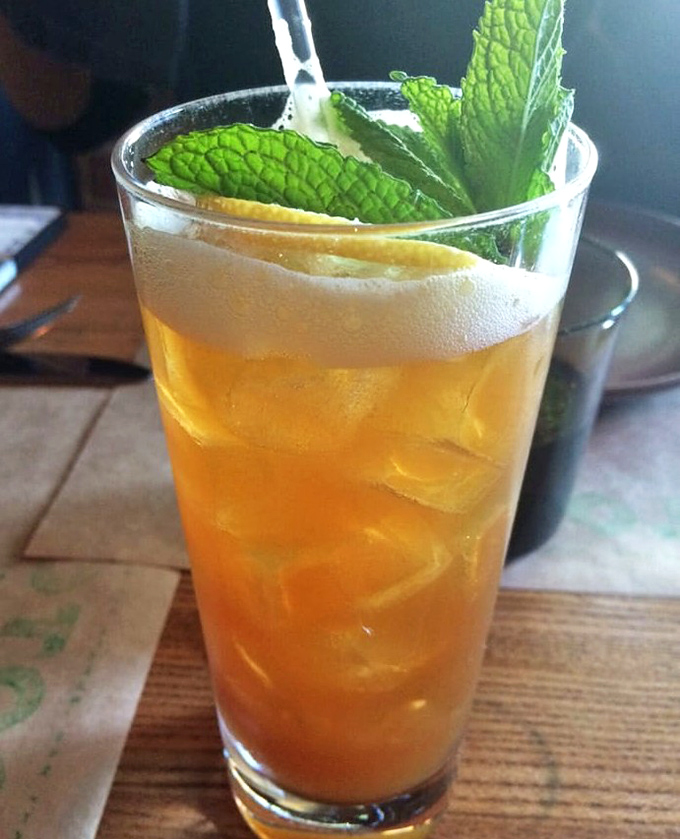 This isn't just a cocktail; it's liquid sunshine garnished with fresh mint. The kind of drink that makes you forget about checking your phone.