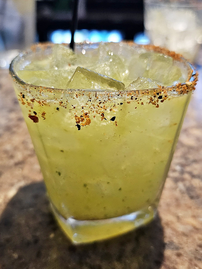 A margarita with a rim so perfectly seasoned it deserves its own Instagram account. Liquid vacation in a glass.