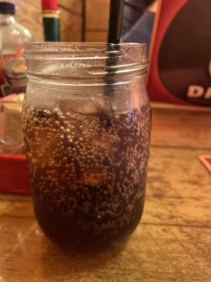 Cold cola in a mason jar, because some drinks just taste better when served with personality.