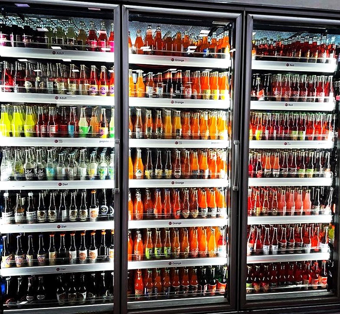 The refrigerated rainbow! POPS' soda selection spans every color spectrum and flavor profile, from classics to concoctions that defy beverage logic.