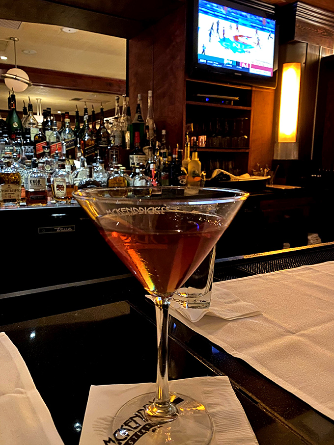 A martini that says, "Today was rough, but tonight is looking up." The bar beckons with promises of adult conversation.