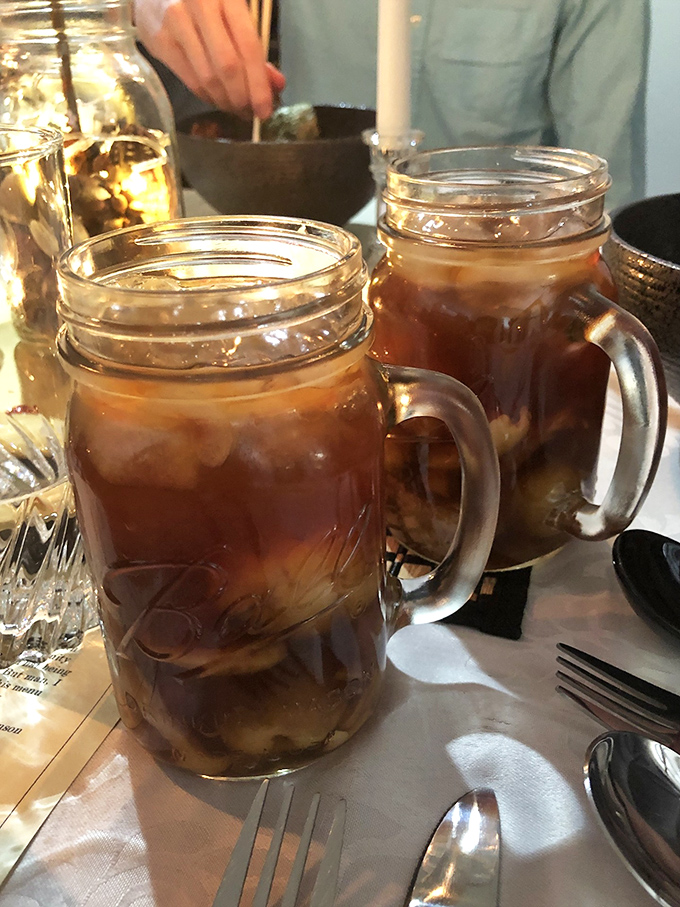 Sweet tea served in Mason jars&mdash;because in the South, proper hydration is as much about tradition as it is about quenching thirst.