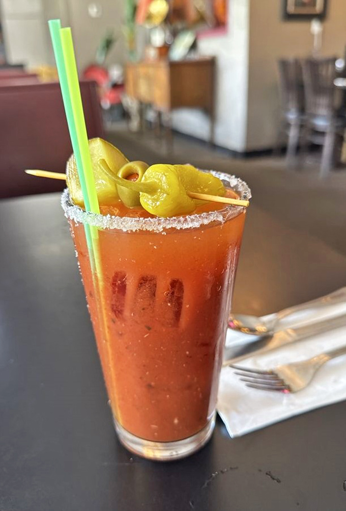 A Bloody Mary garnished like it's trying to upstage the food. The kind of drink that counts as both beverage and appetizer.