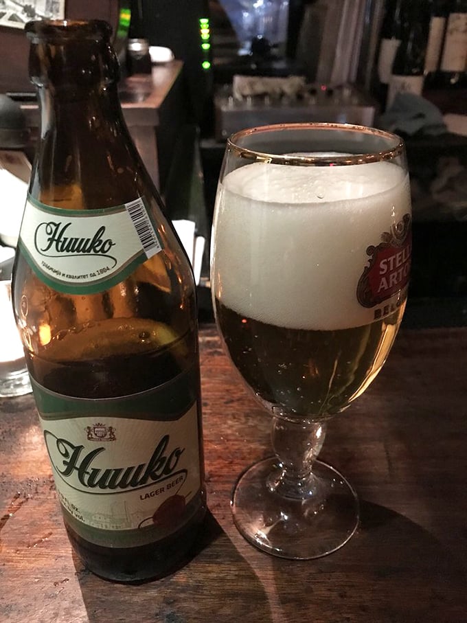 Nothing complements Serbian cuisine quite like a cold Nik&scaron;ićko beer, its crisp flavor cutting through the richness of the hearty dishes.