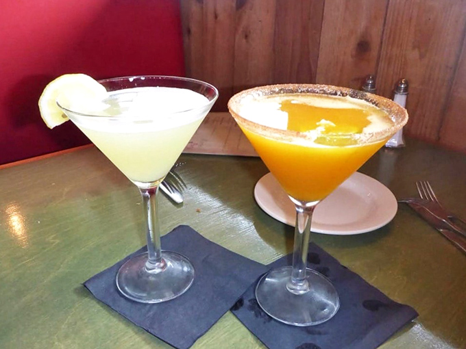 Cocktails that look like liquid sunshine, served in a place where "just one more" becomes the evening's unofficial motto.
