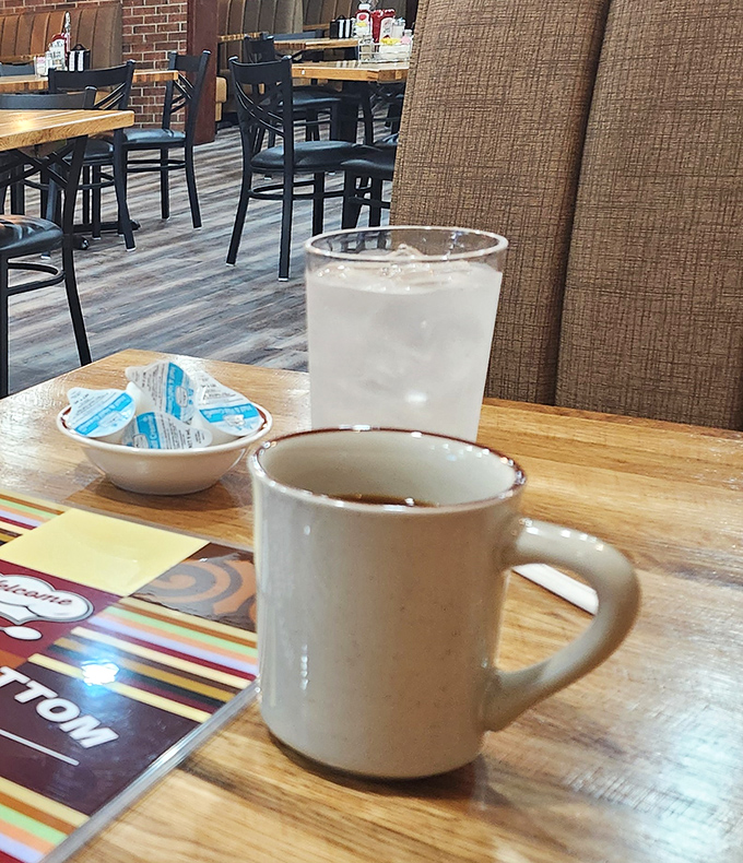 The classic diner tableau: a sturdy mug of coffee that means business, water to cleanse the palate, and the promise of good things to come.