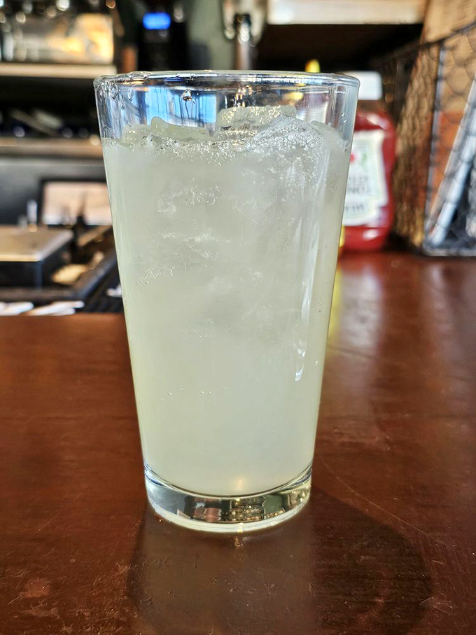 A refreshing glass of what looks like lemonade, because even diners need their sophisticated moments.
