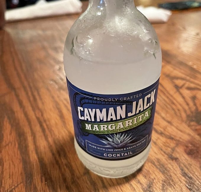 A Cayman Jack margarita – because sometimes you need something bright and tangy to cut through all that rich, smoky goodness.