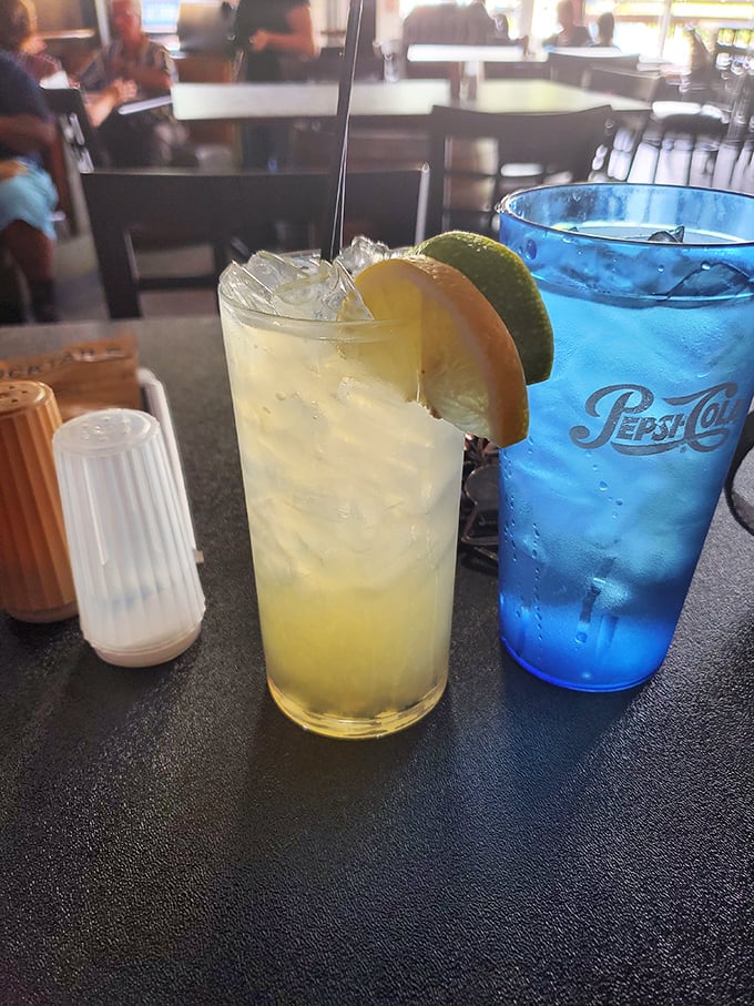 Even the drinks here tell a story – a refreshing citrus concoction that's the perfect counterpoint to smoky barbecue, like finding an oasis in a delicious desert.