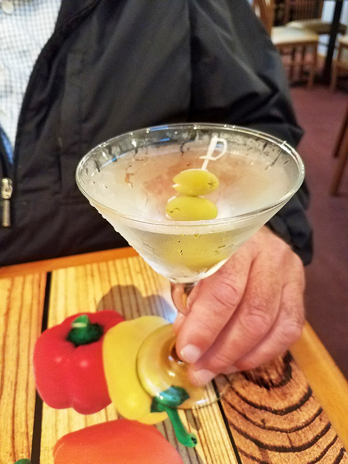 A classic martini with olives&mdash;because sometimes pizza deserves a sophisticated dance partner instead of just beer, like pairing sneakers with a tuxedo.