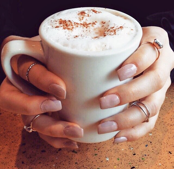 Those hands cradling that coffee mug understand something profound: sometimes the simplest pleasures, like a warm drink with cinnamon, matter most.