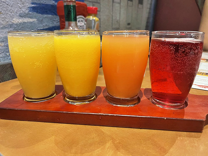 A flight of colorful beverages that promises to wash down your massive sandwich with something sweeter than desert rain. Hydration never looked so festive.