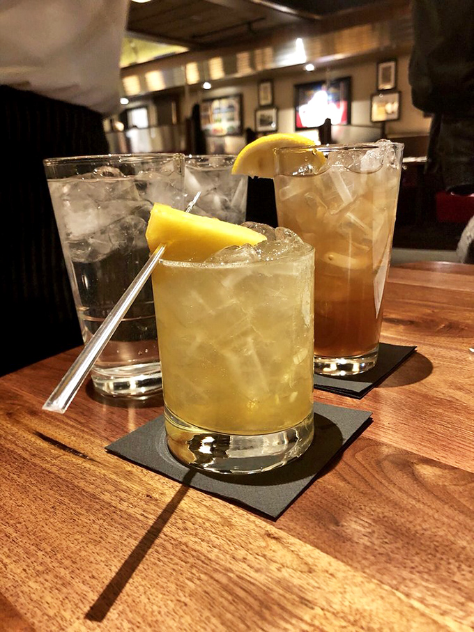 Cocktails that sparkle with promise, garnished with fresh citrus. The kind of drinks that make you lean back and say, "Now, this is living."