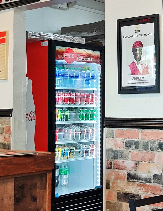 The beverage cooler &ndash; where ice-cold sodas stand at attention, ready to combat Florida heat and pizza-induced thirst with refreshing efficiency.