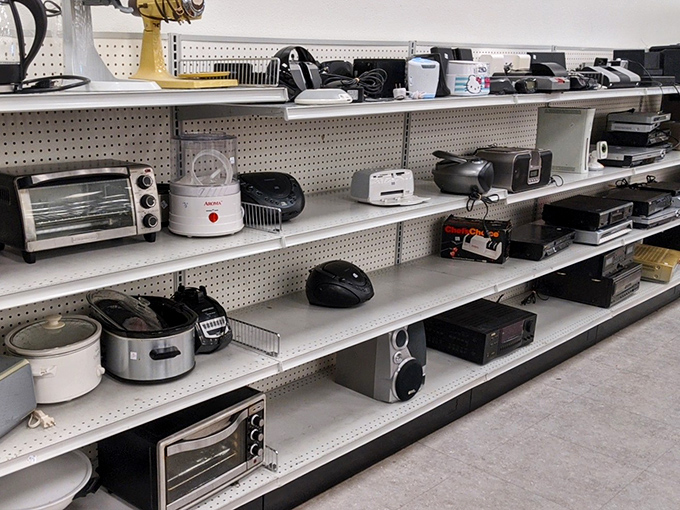 The electronics section: where bread machines and toaster ovens enjoy their retirement years, hoping for one more chance to prove their worth.