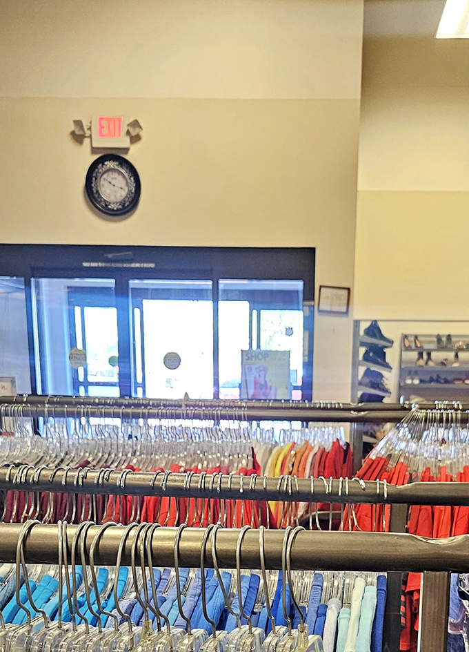 Color-coded clothing racks organize the fashion chaos, making it easier to spot that perfect blue blouse among the rainbow.