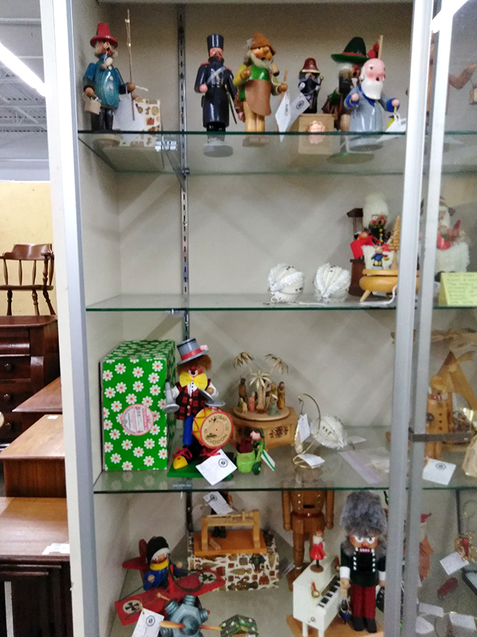 Wooden figurines stand guard over memories &ndash; each one a tiny ambassador from simpler times.