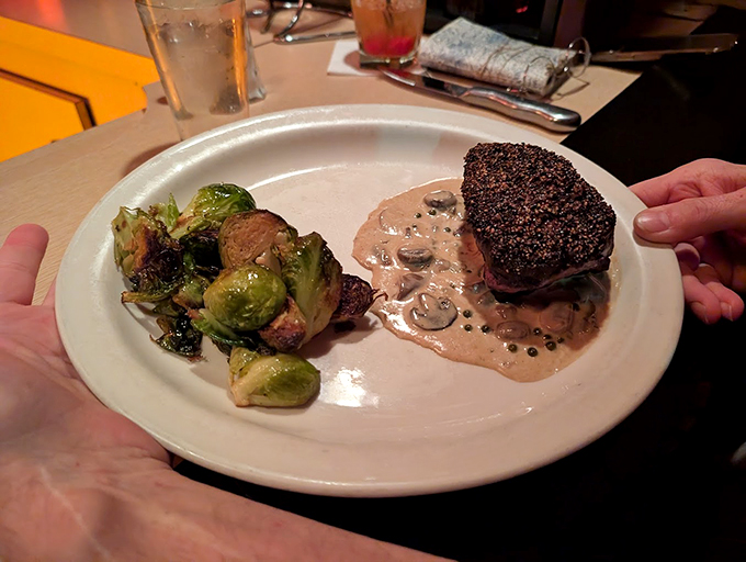 The filet mignon bathes in mushroom cognac cream sauce, creating a partnership more perfect than Bogart and Bacall.