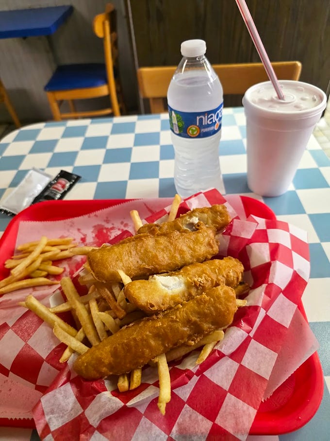 Golden-battered fish that crunches like autumn leaves, served with fries so perfect they deserve their own fan club. Simple food done right.