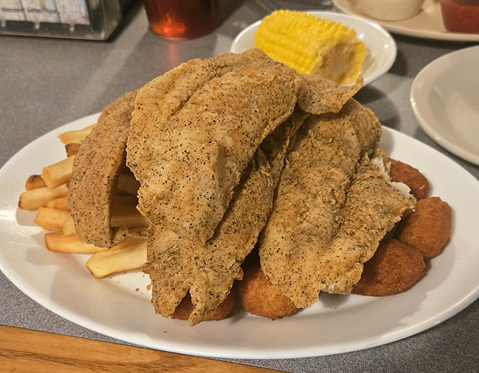Cornmeal-crusted fish fillets that could make a pescatarian weep with joy. The kind of comfort food that feels like a warm hug from a salty sea captain.