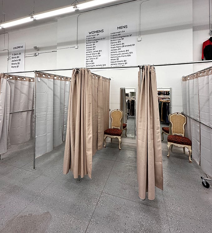 Fitting rooms with elegant chairs that say, "Yes, we're a thrift store, but we still have standards, darling."