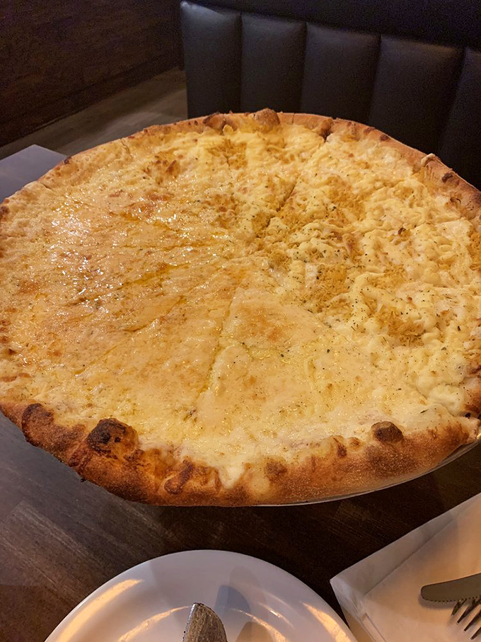 Four cheese pizza that doesn't just satisfy your dairy cravings&mdash;it throws a full-blown cheese festival in your mouth.