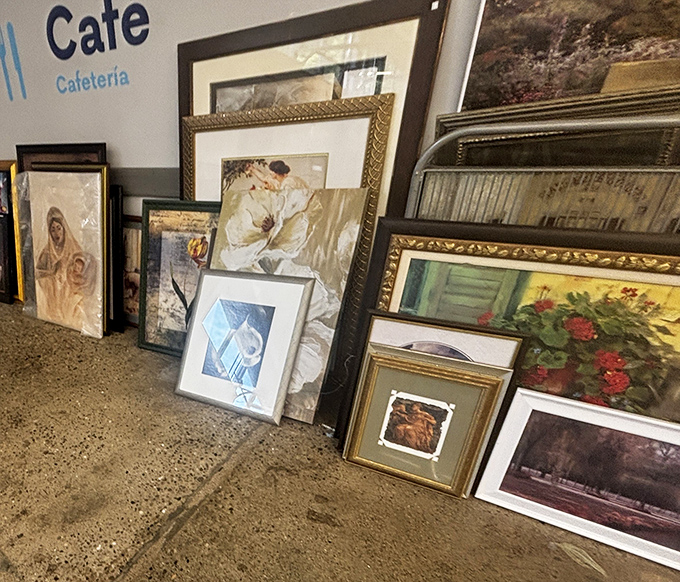 Gallery wall potential leaning against the wall near the caf&eacute;. Someone's discarded art becomes your living room's conversation piece for less than a movie ticket.