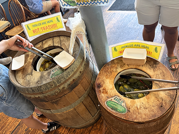 Pickle barrels stand ready for self-service, because sometimes you need to fish for your own crunchy, briny treasure.