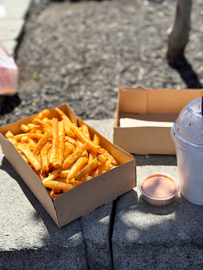 These aren't just fries&mdash;they're golden happiness sticks, perfectly positioned next to that essential cup of Utah's famous fry sauce.